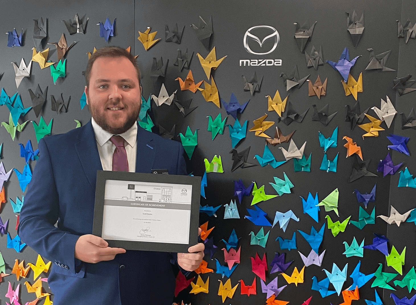 Scott Davies receiving his Mazda accreditation